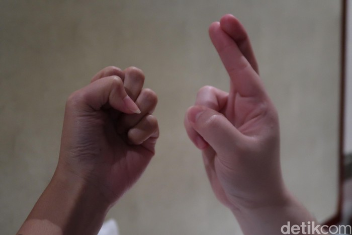 Potret Orang China Simbolkan Angka dengan Jari Tangan